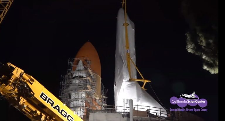 Endeavour shuttle lifted into new upright display